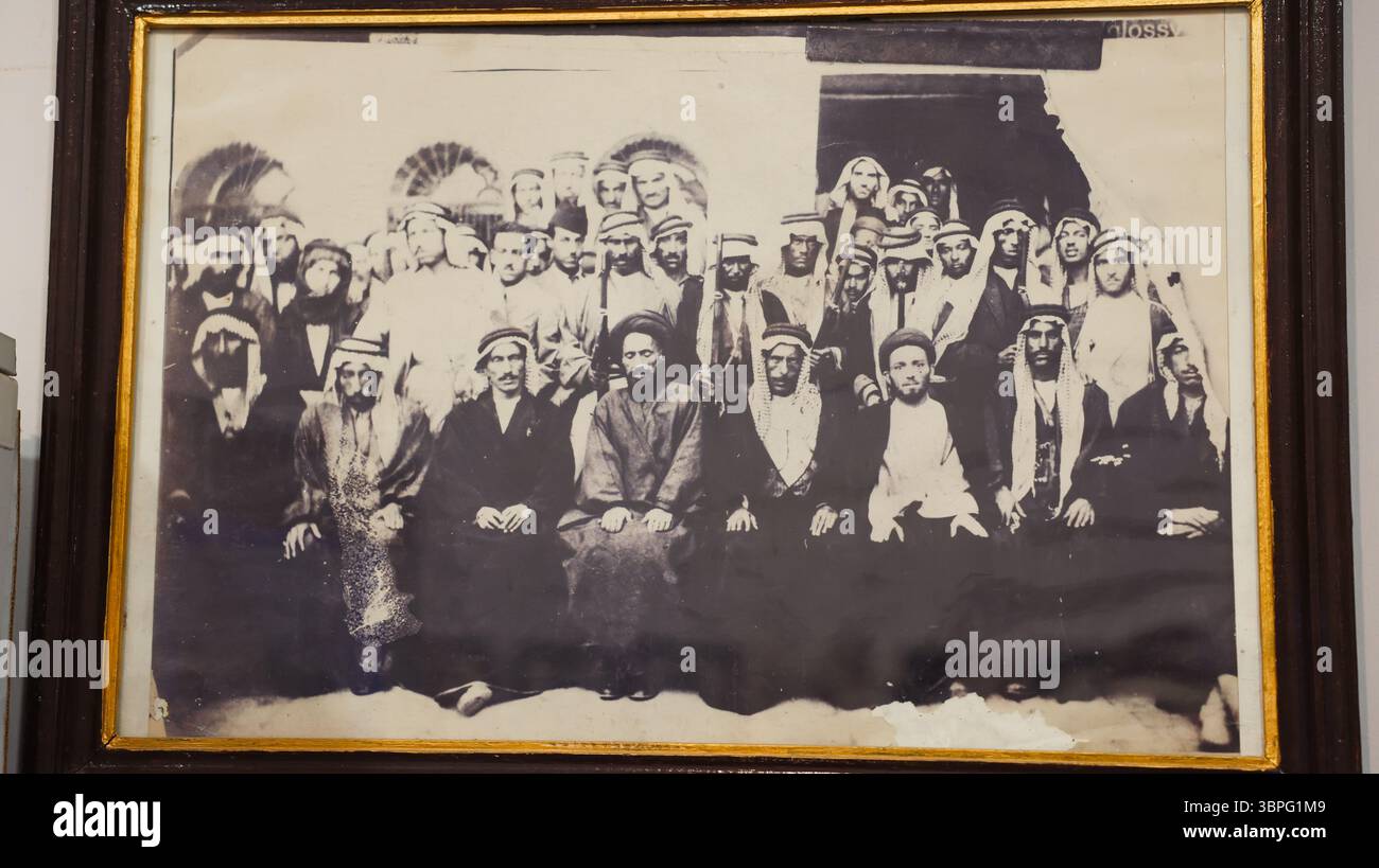 A large group of men dressed in traditional attire gather at Hilla ...