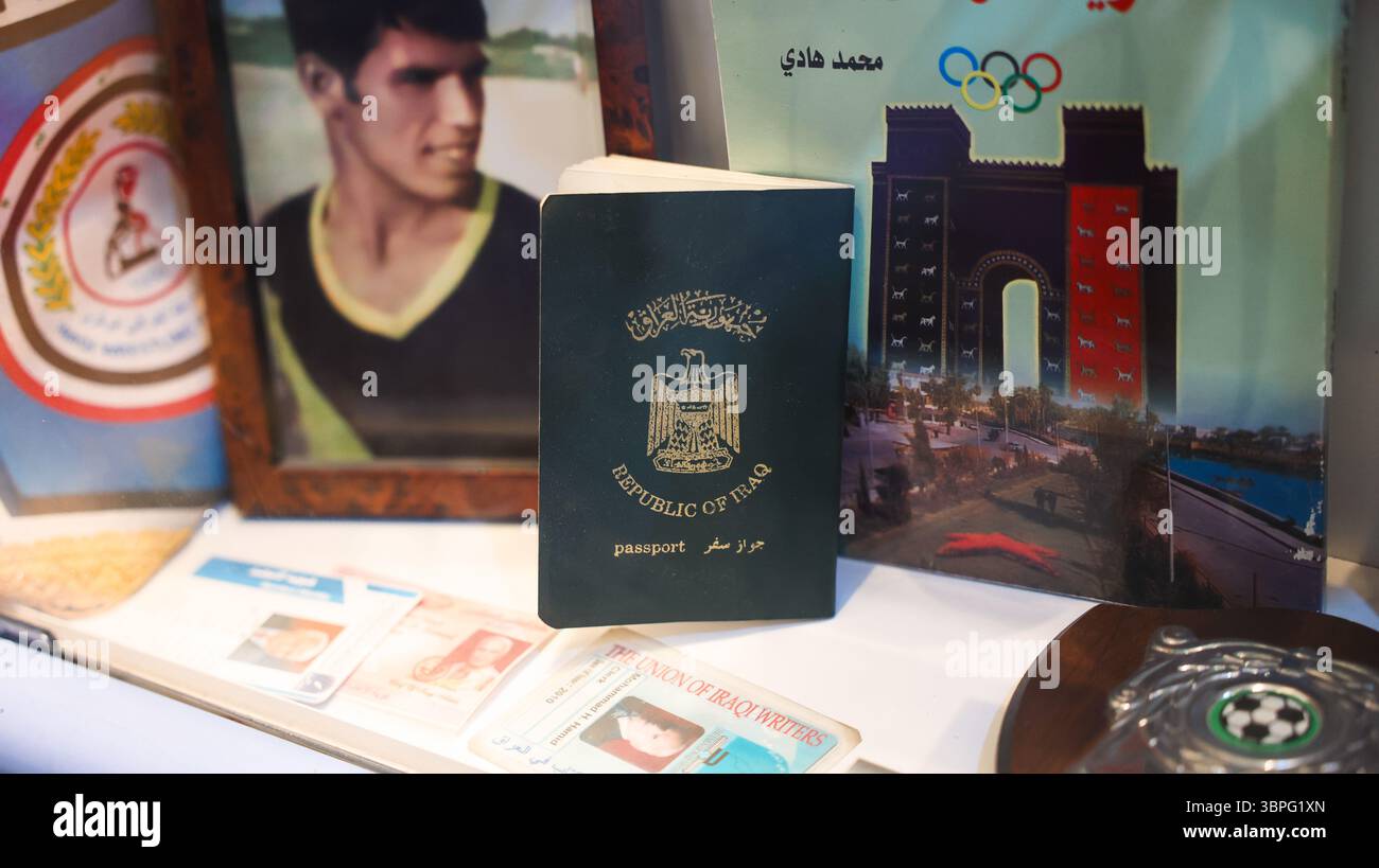 Visitors explore exhibits featuring Iraqi passports, photographs, and ...