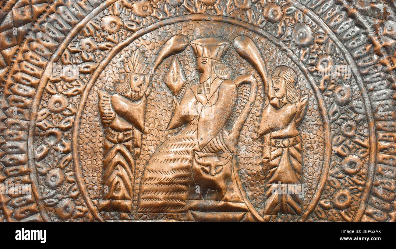 Metal relief sculpture depicting figures from ancient Mesopotamia ...