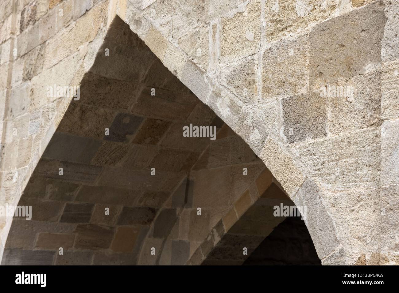 Stone archs of historical architecture form part of an ancient building ...