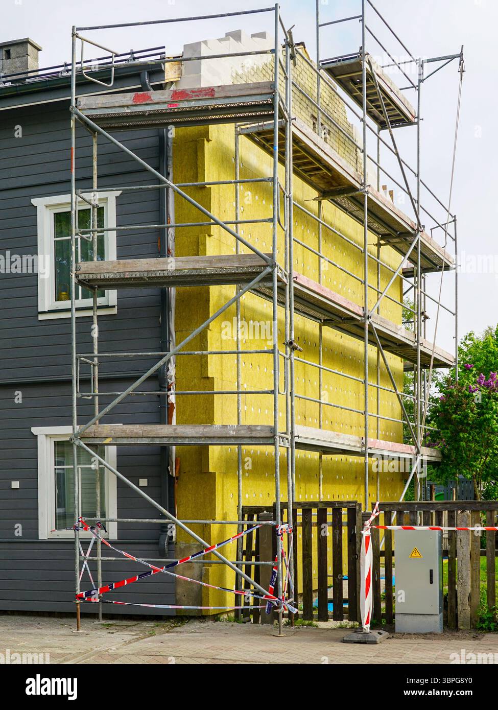 Scaffolding and Thermal Insulation Installation on a Residential House ...