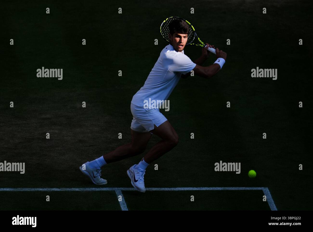 Carlos Alcaraz during his Gentlemen's Singles match against Cameron Norrie on day nine of the ...