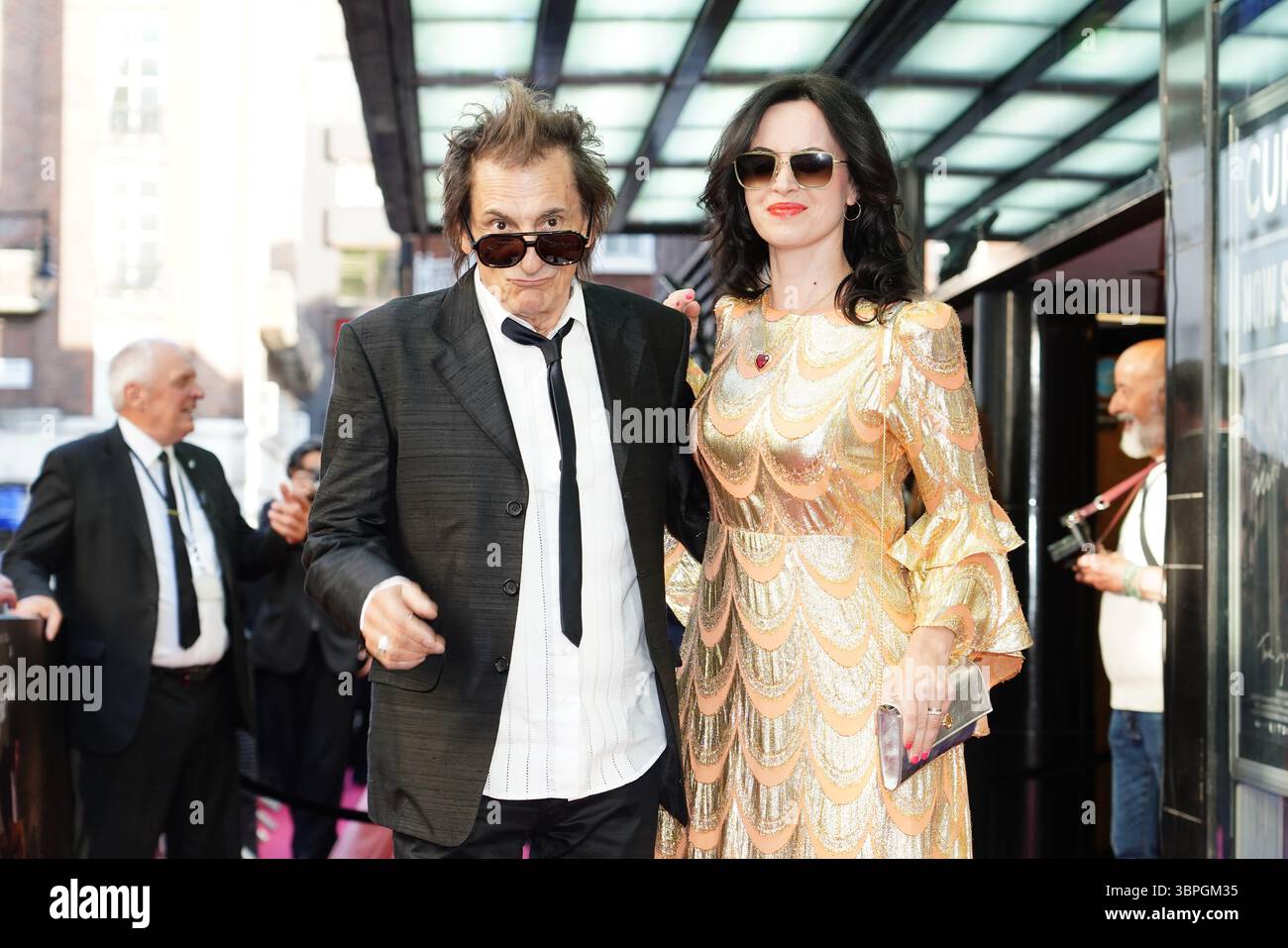 Ronnie and Sally Wood arriving for the UK premiere of Modigliani ...