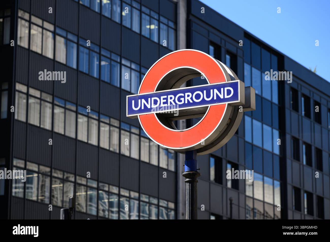 London, UK - April 2, 2025 London Underground roundel on pole against ...