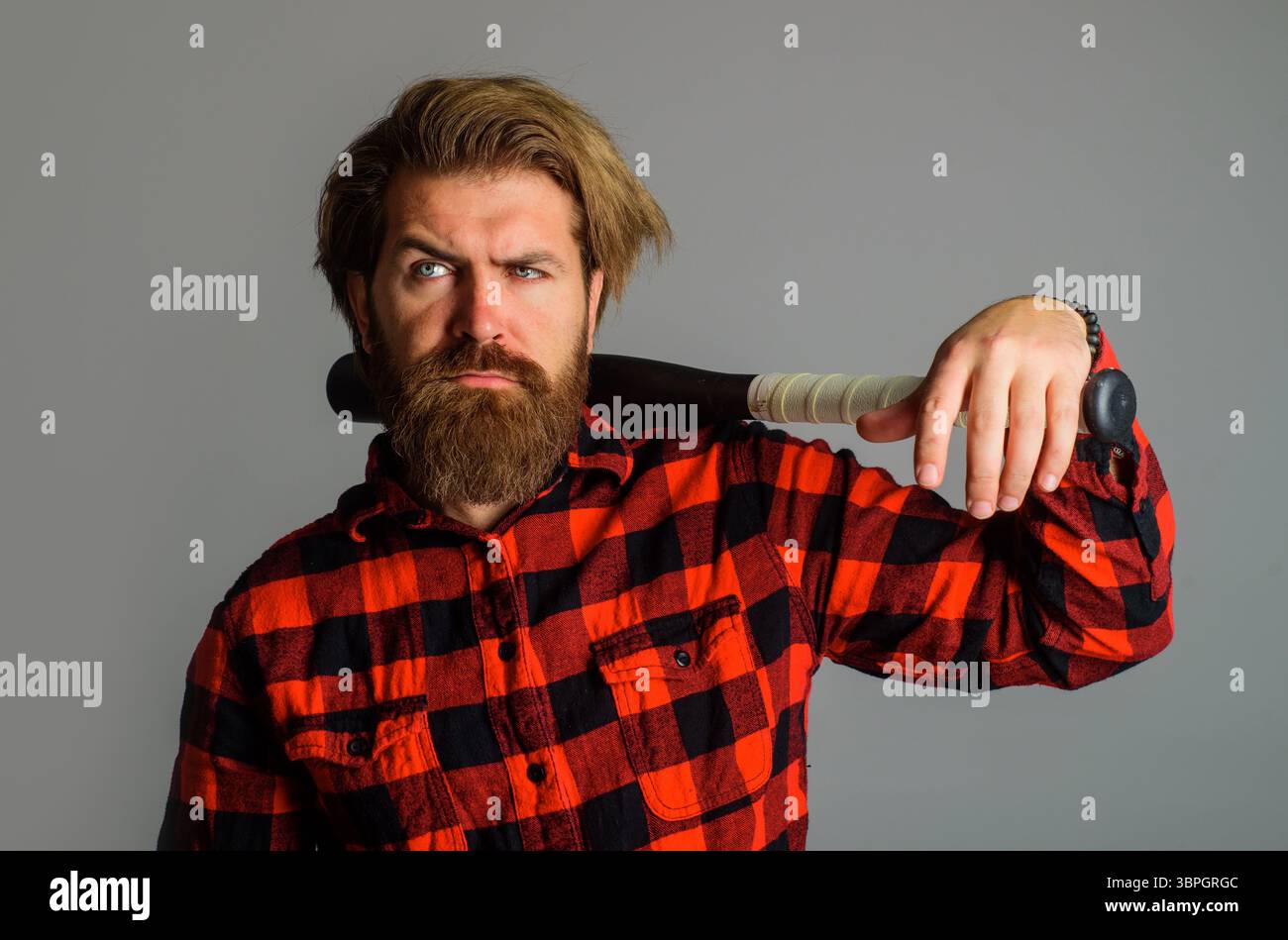 Bearded man in plaid shirt with baseball bat. Handsome male in ...