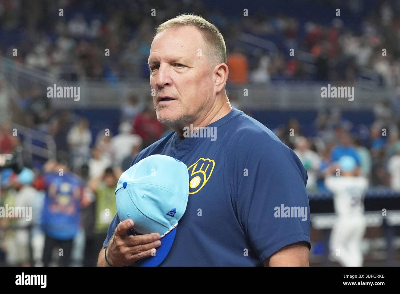Milwaukee Brewers manager Pat Murphy stands for the national anthem ...