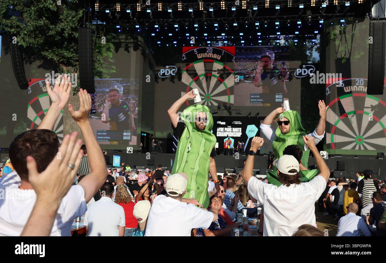 Fans react during The Hyde Park Darts Championship in London. Picture ...