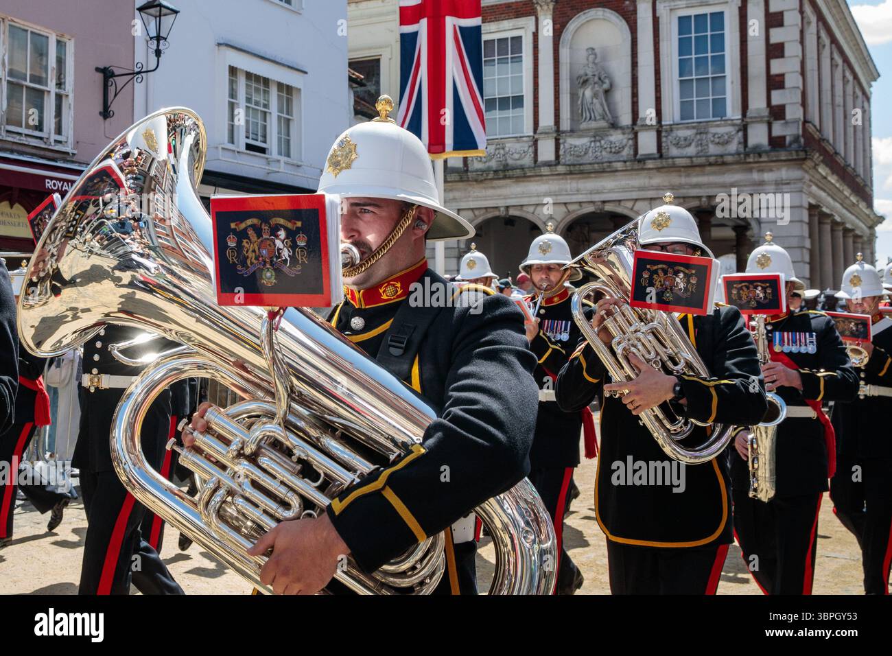 Windsor, UK. 8th July, 2025. A marching military band passes along ...