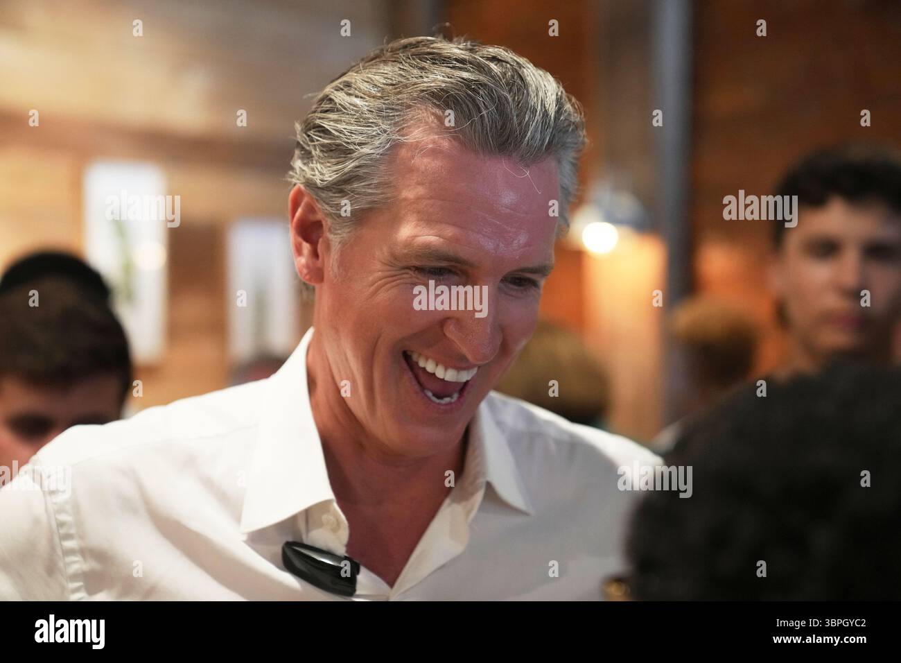 Gov. Gavin Newsom, D-Calif., greets people after addressing a crowd at ...