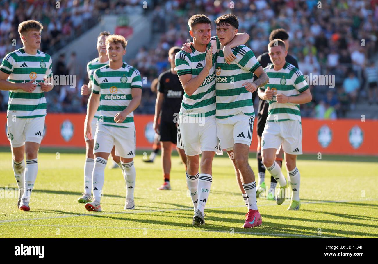 Celtics' Colby Donovan (right) celebrates scoring their side's second ...