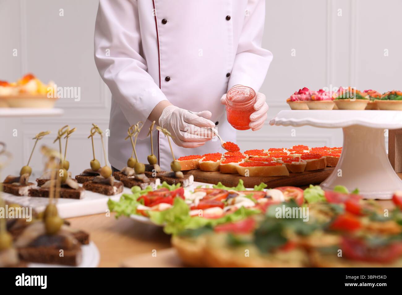 Chef making sandwiches red caviar hi-res stock photography and images ...