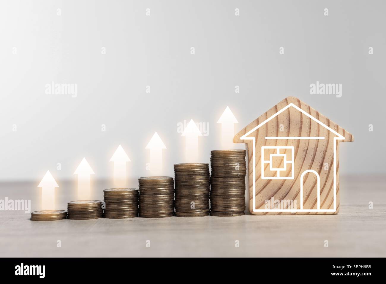 Increase in real estate value. House model and coins on table. Growing ...