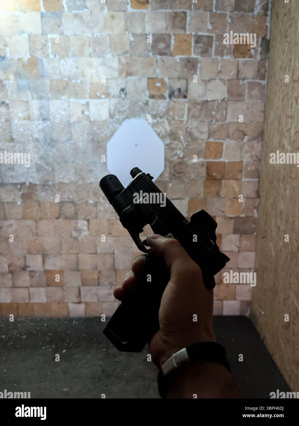Tactical shooting in low-light conditions. A hand is holding a pistol ...