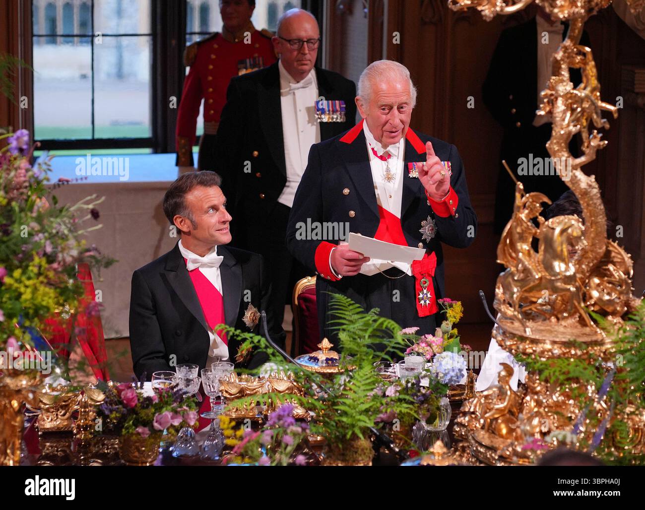 King Charles III (right) speaking at the State Banquet for President of ...