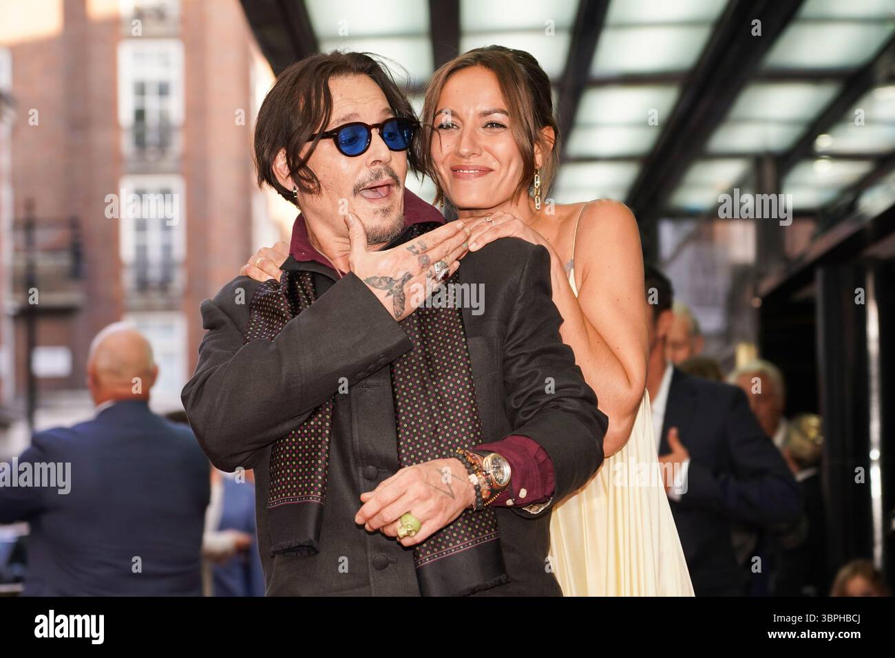 Johnny Depp, left, and Antonia Desplat pose upon arrival at the ...