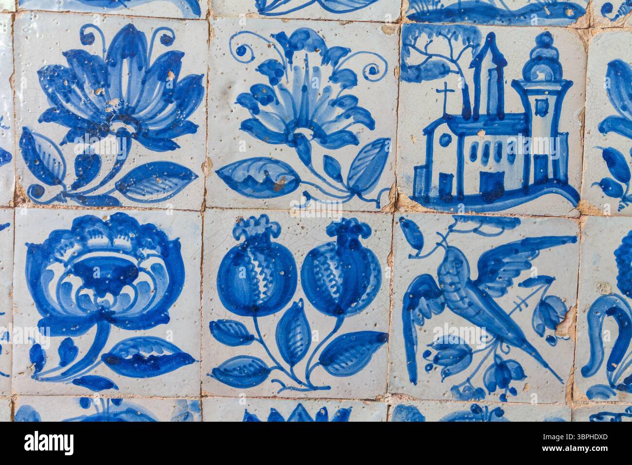 a detailed close-up of a wall covered in traditional Portuguese blue ...