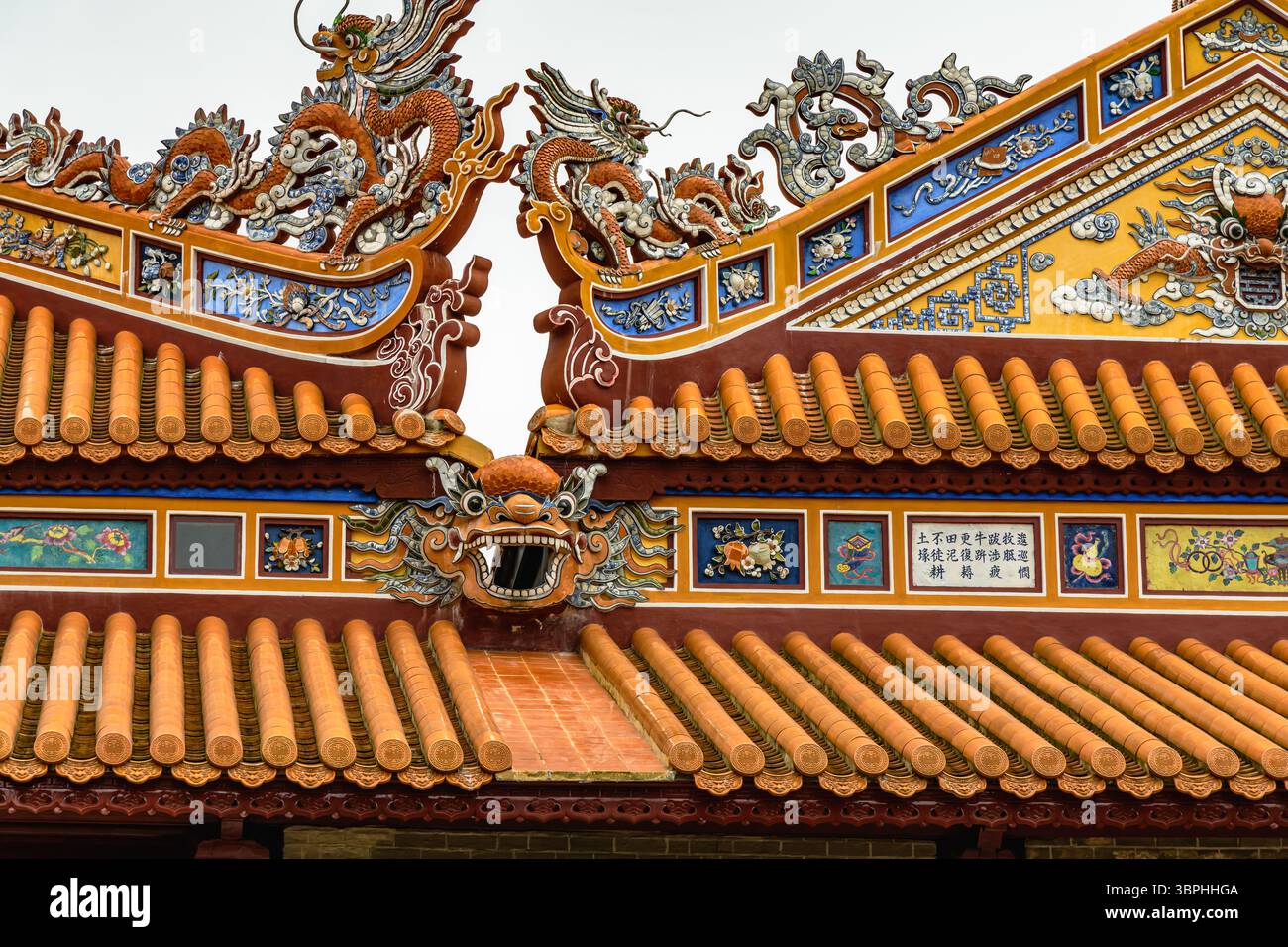 Detailed view of ornate roof decorations at the Hue Imperial City in ...