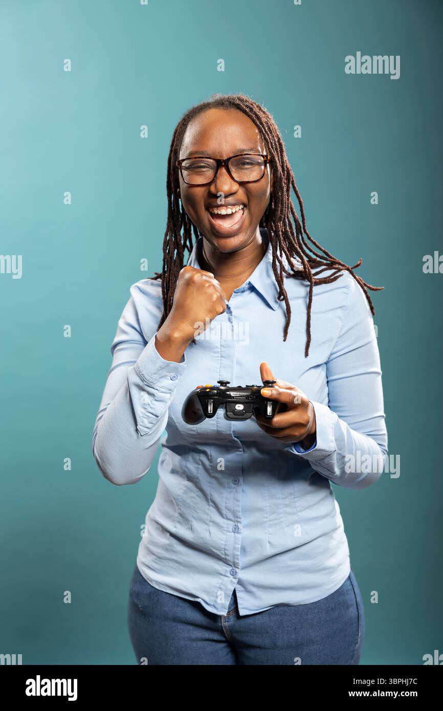 Pretty woman holding gamepad hi-res stock photography and images - Alamy