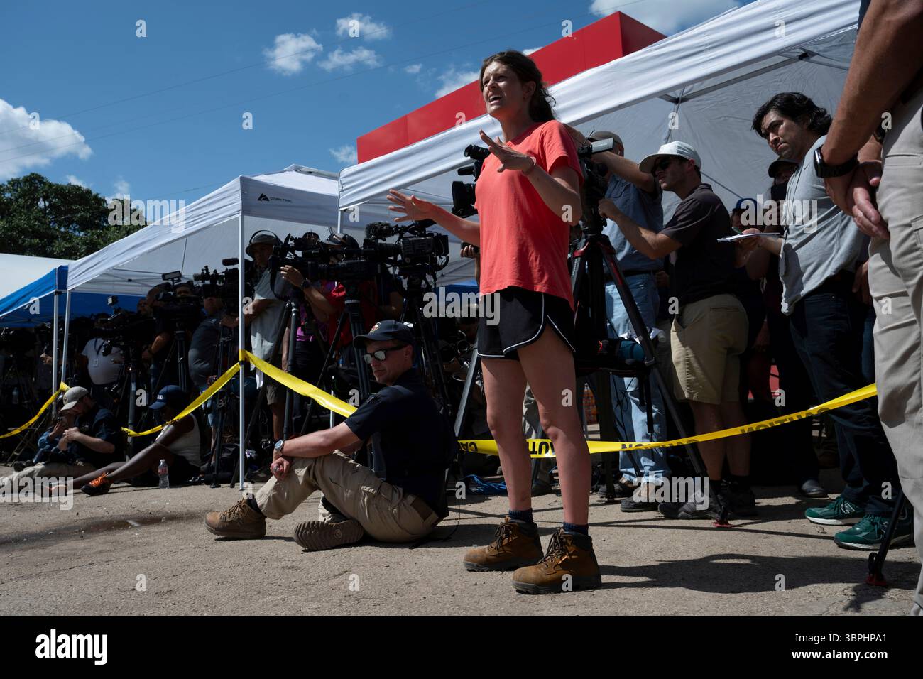 Courtney Calhoun, a resident in Kerr County, speaks at a press ...