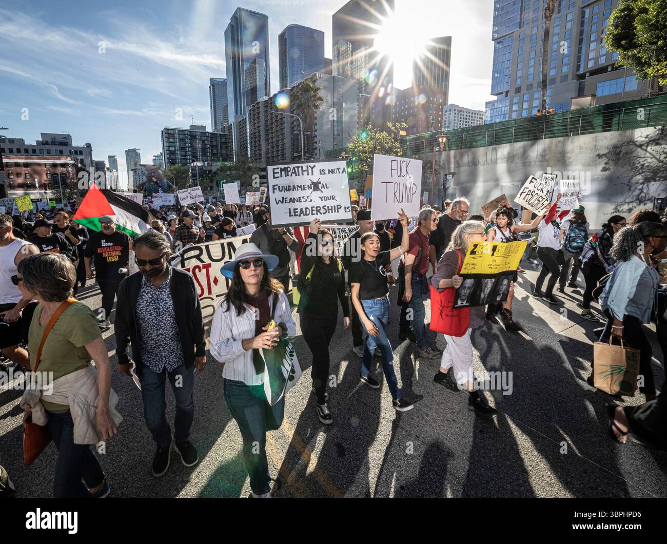 Protestors march through the streets during the Hands Off protest in ...