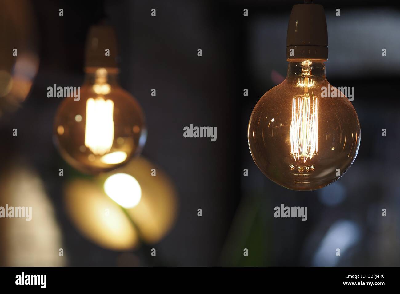 Warm glow of vintage light bulbs in a cozy setting Stock Photo - Alamy