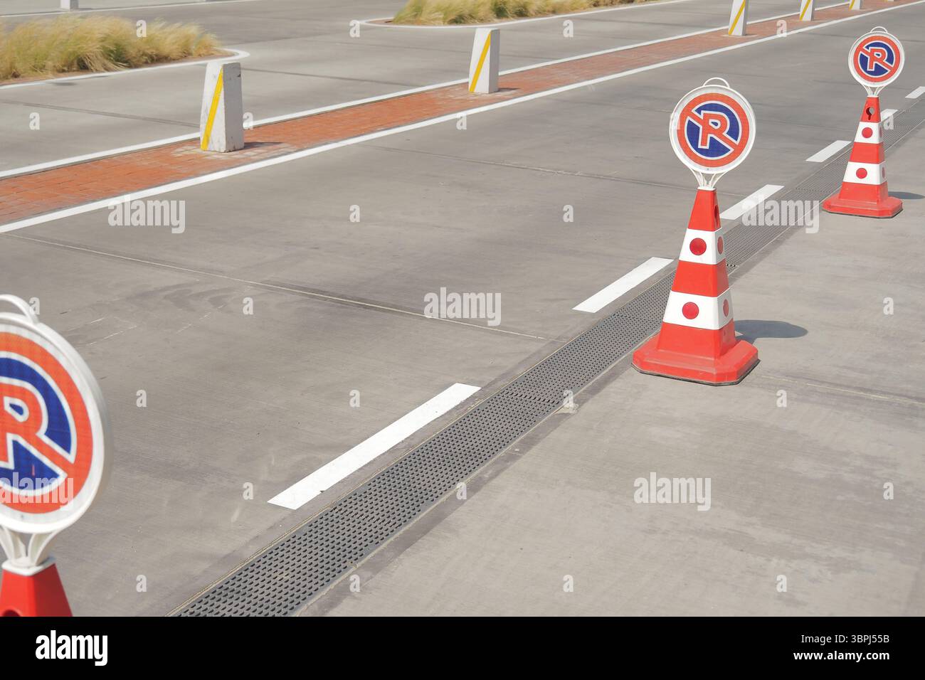 Road safety cones mark construction zone near pavement Stock Photo - Alamy