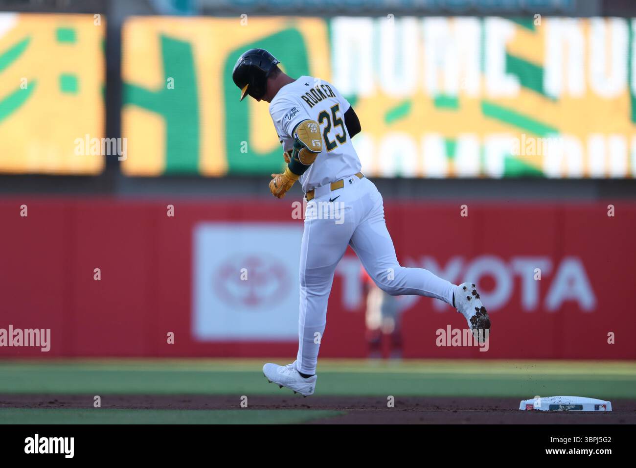 Athletics' Brent Rooker jogs around the bases after hitting a two-run ...