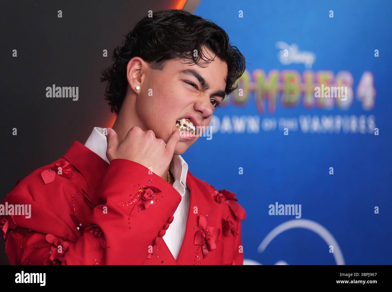 Malachi Barton poses at the premiere of "Zombies 4: Dawn of the ...