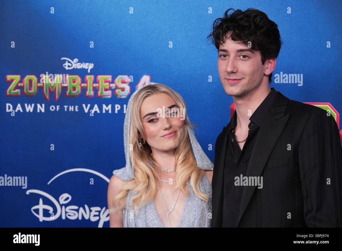Meg Donnelly, left, and Milo Manheim pose together at the premiere of ...