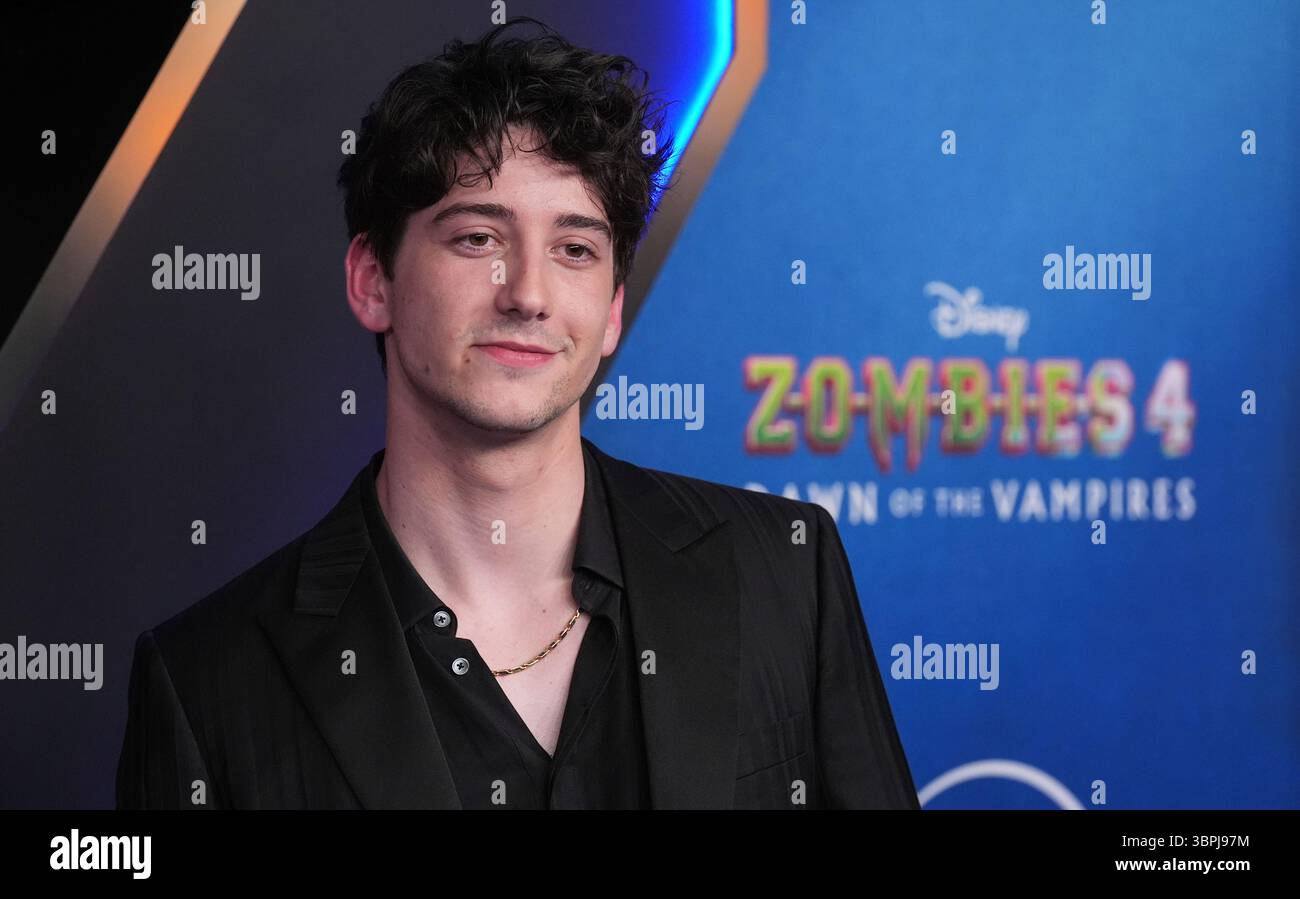 Milo Manheim poses at the premiere of "Zombies 4: Dawn of the Vampires ...