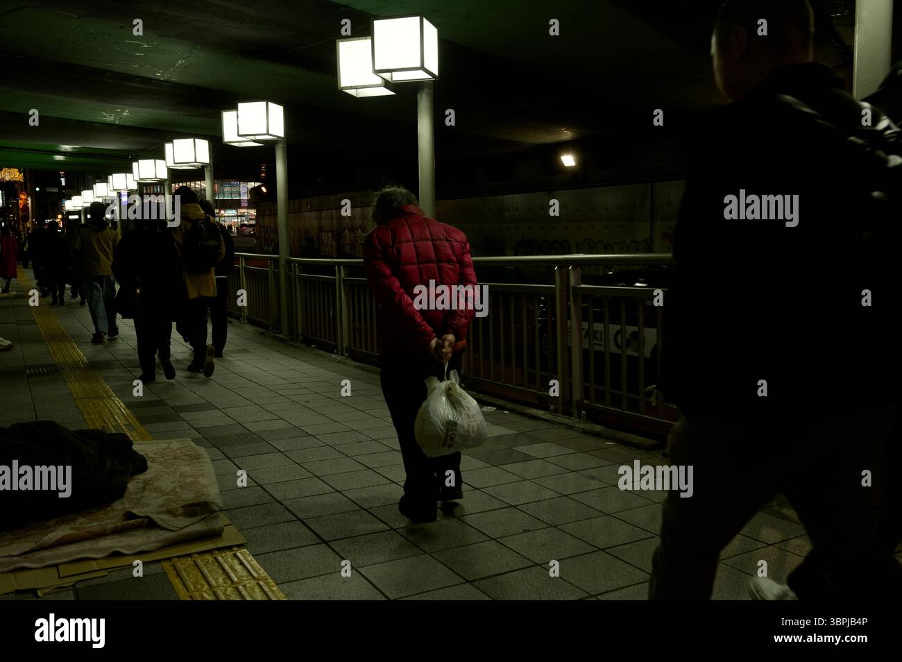 Man walking alone night under hi-res stock photography and images - Alamy