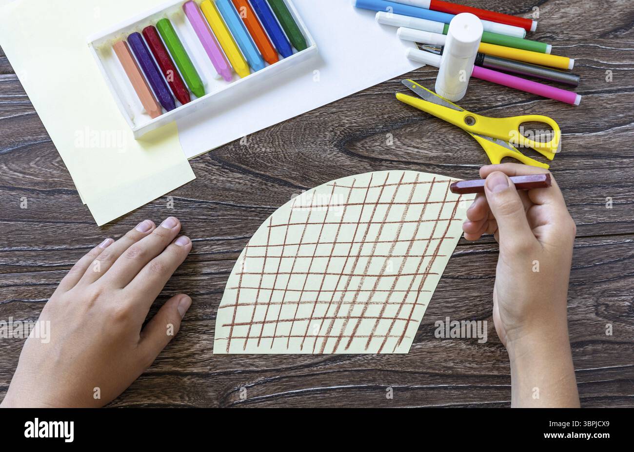 Instruction step 3. Paper Fan paper ice cream on a wooden table ...