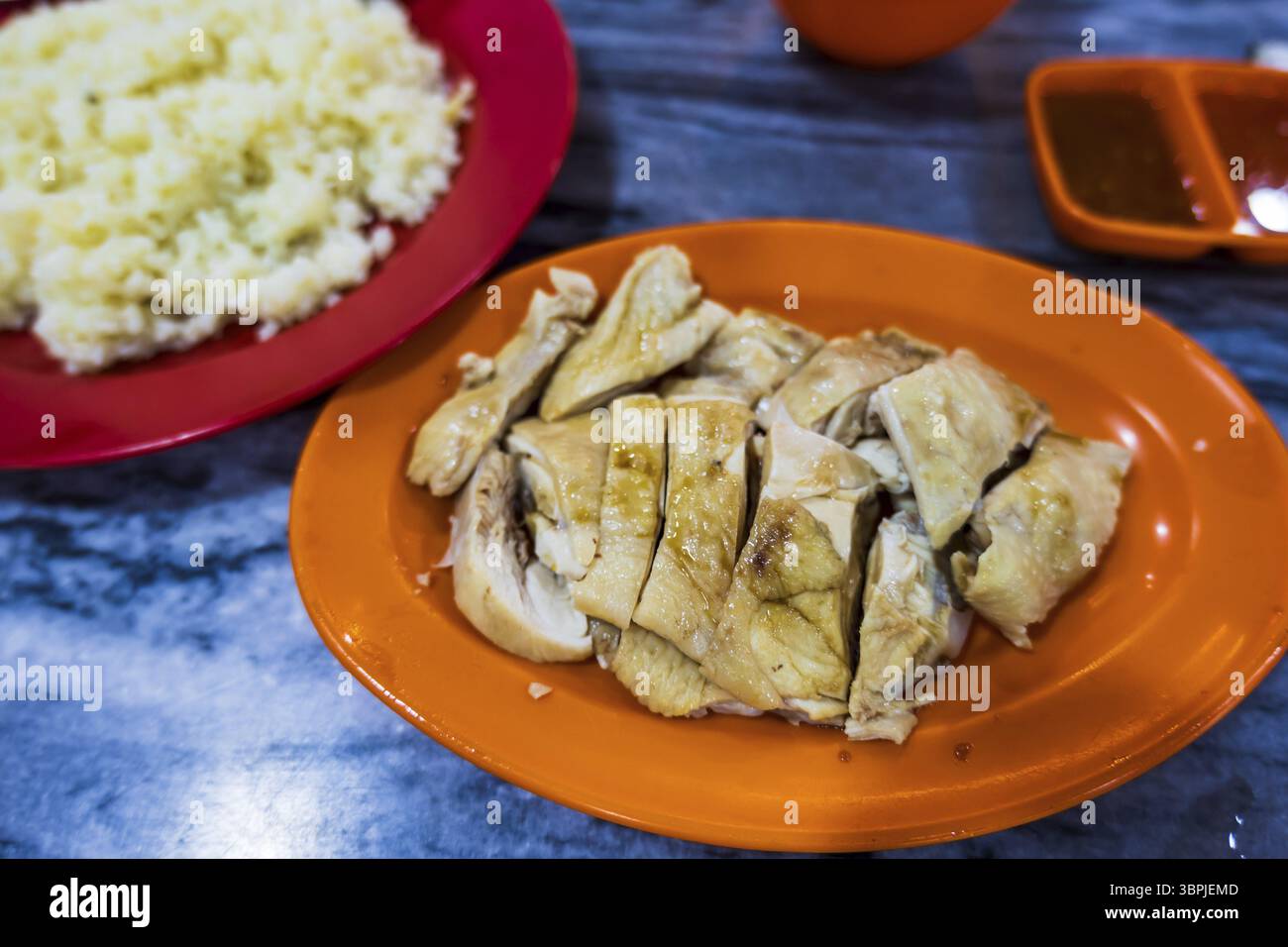 Hainanese steamed chicken rice at hawker stall, a famous dish in ...
