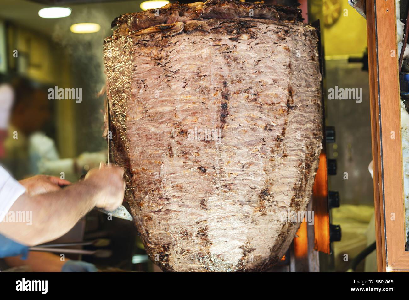 Kebab meat rotating, known as donor or shawarma. A popular street food ...