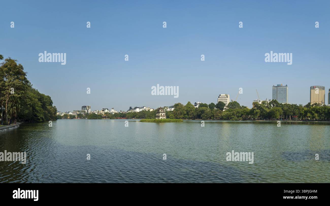 Hoan Kiem lake in Hanoi, Vietnam, with famous Turtle tower. An iconic ...