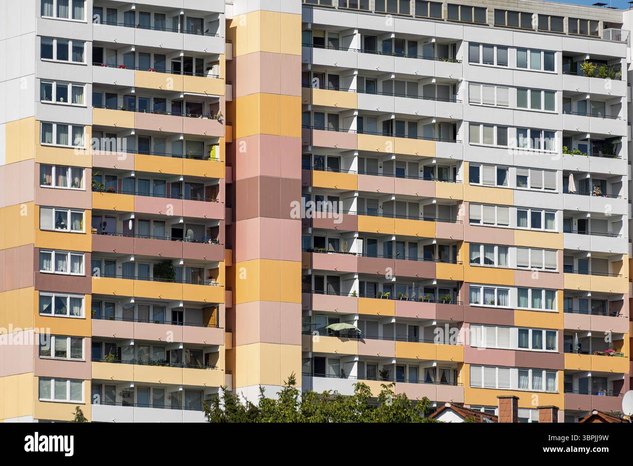 The colourful concrete facade of a high-rise residential building with ...