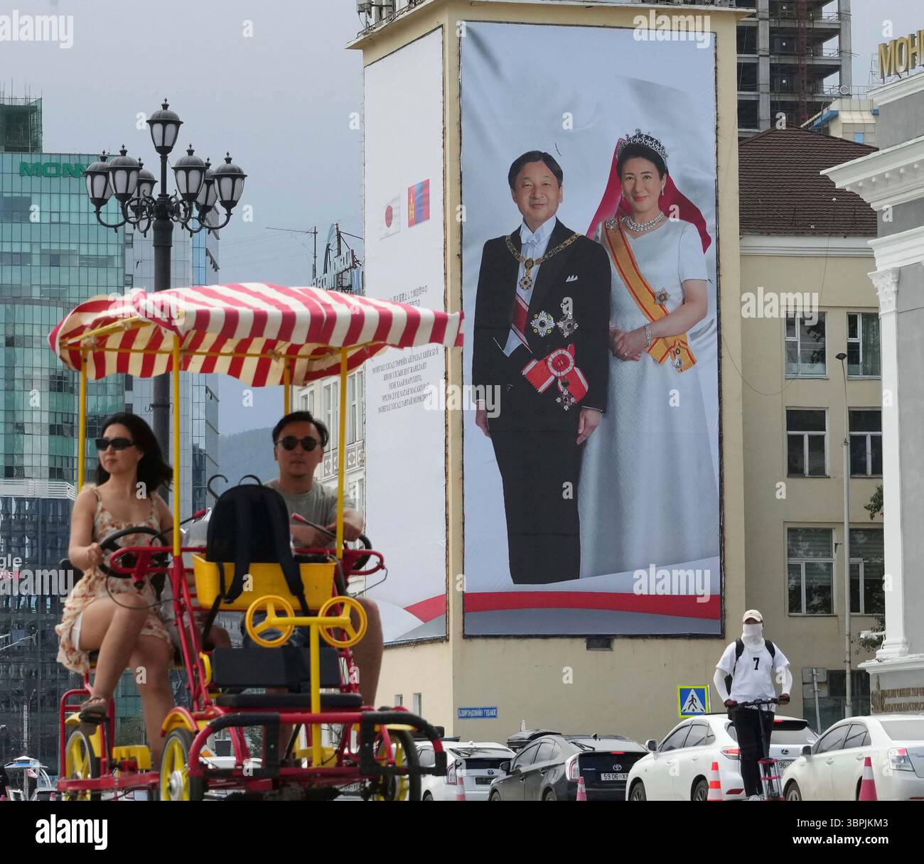 A giant picture of Japanese Emperor Naruhito and Empress Masako is ...