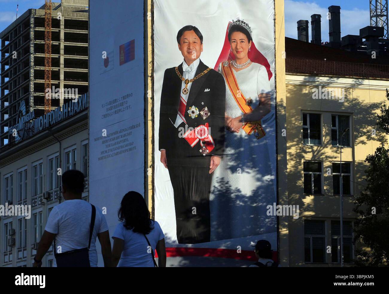 A giant picture of Japanese Emperor Naruhito and Empress Masako is ...