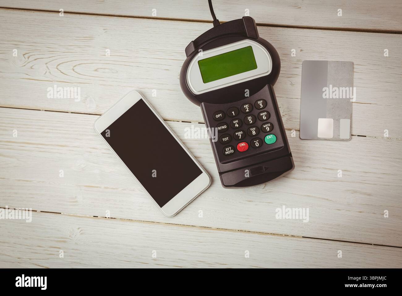 Scene is showing smartphone, payment terminal and credit card on white ...