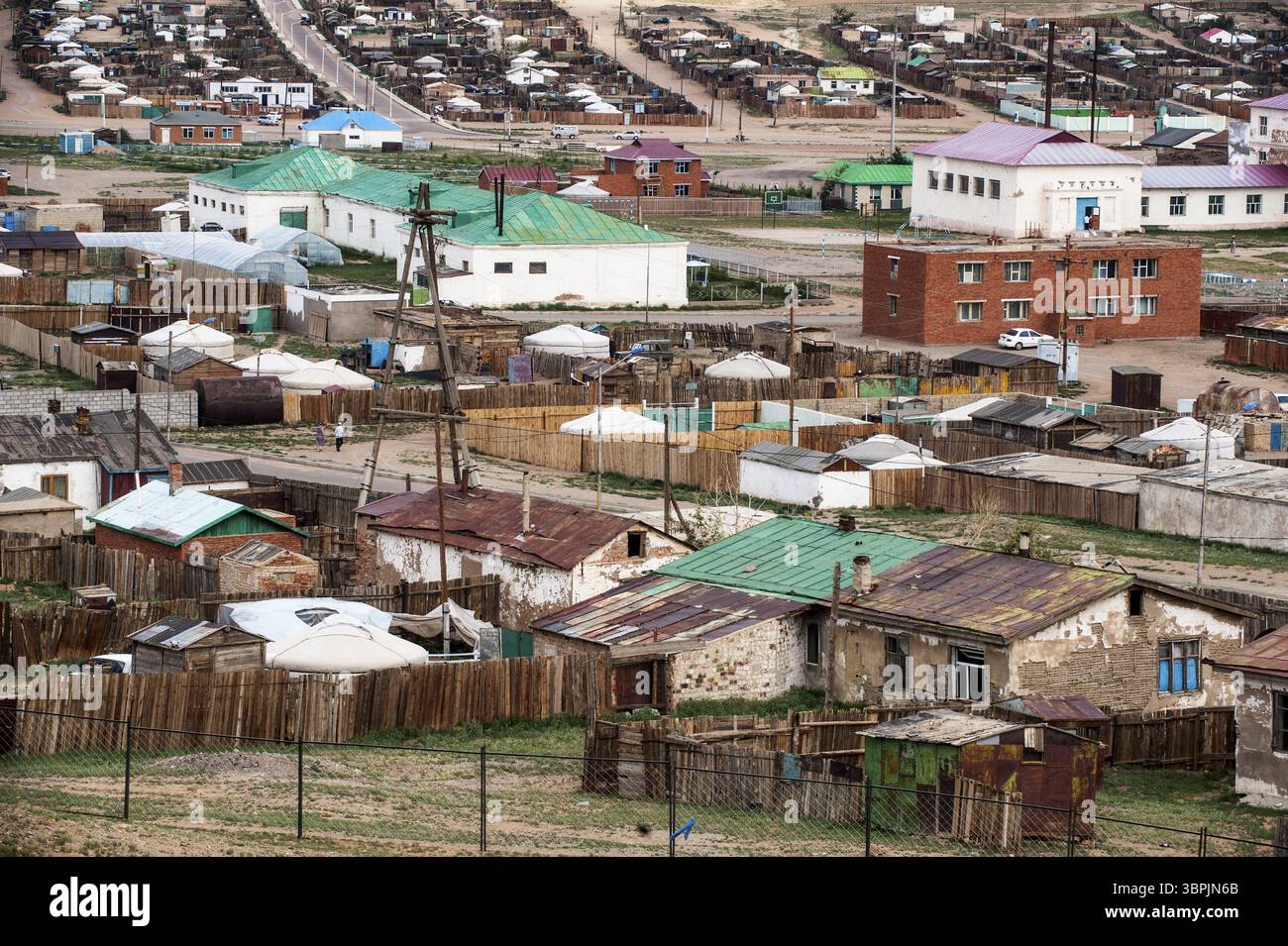 A human settlement in the Mongolian steppe with houses, huts, yurts and ...