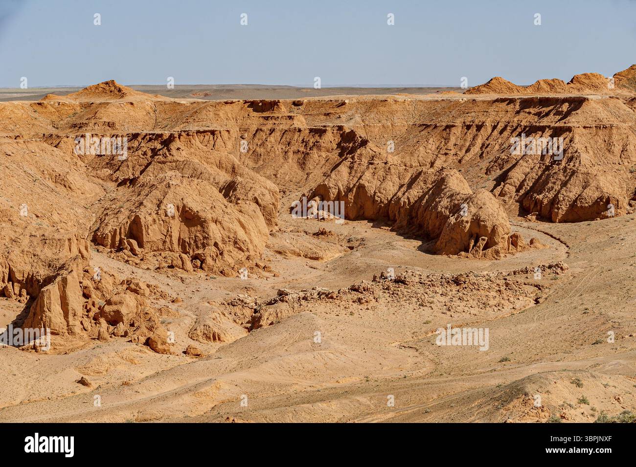 Plain with red rocks in the dry landscape of the Gobi Desert in ...
