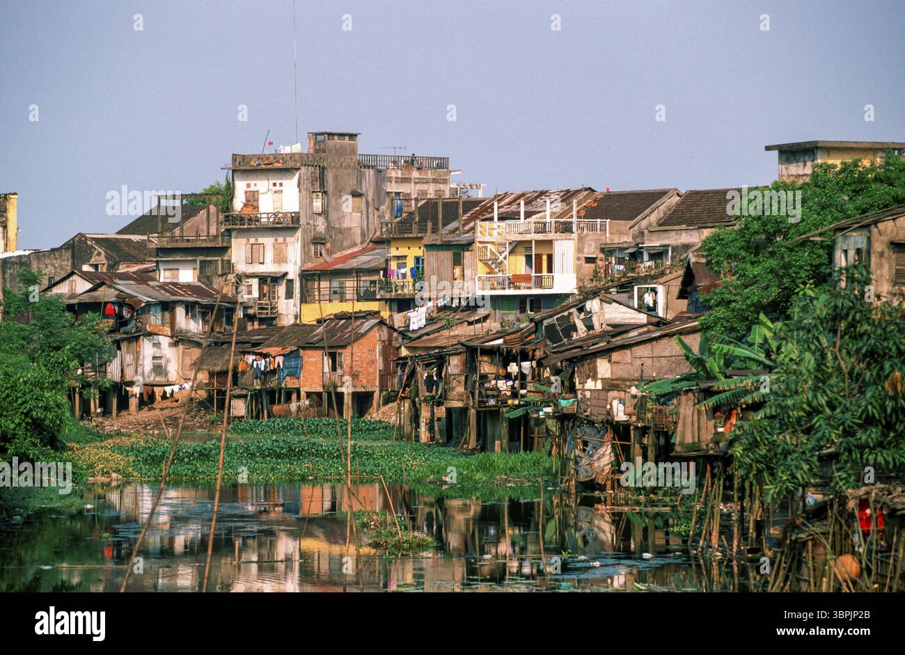 Scanned slide of a historical colour photograph of the slum in the old ...