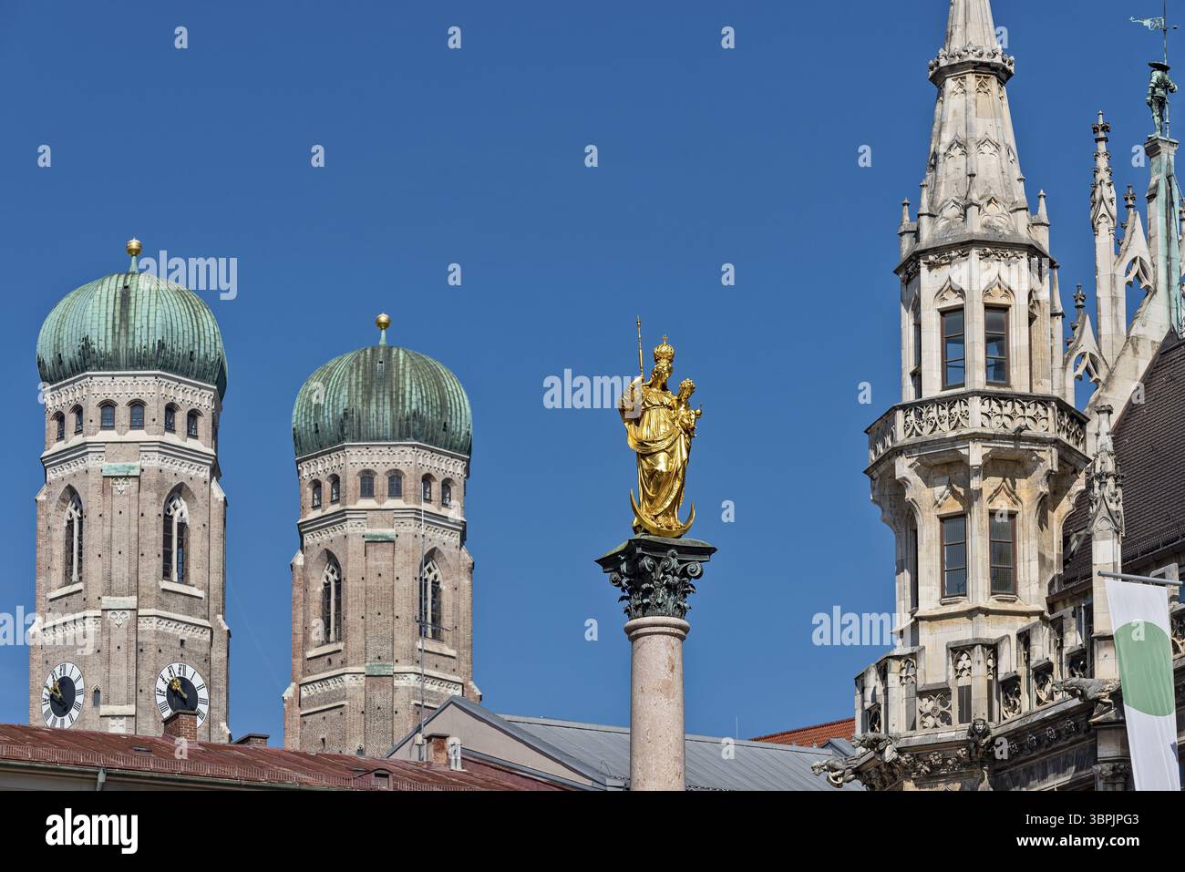 The gilded statue of Mary with Jesus in her arms on the Marian column ...