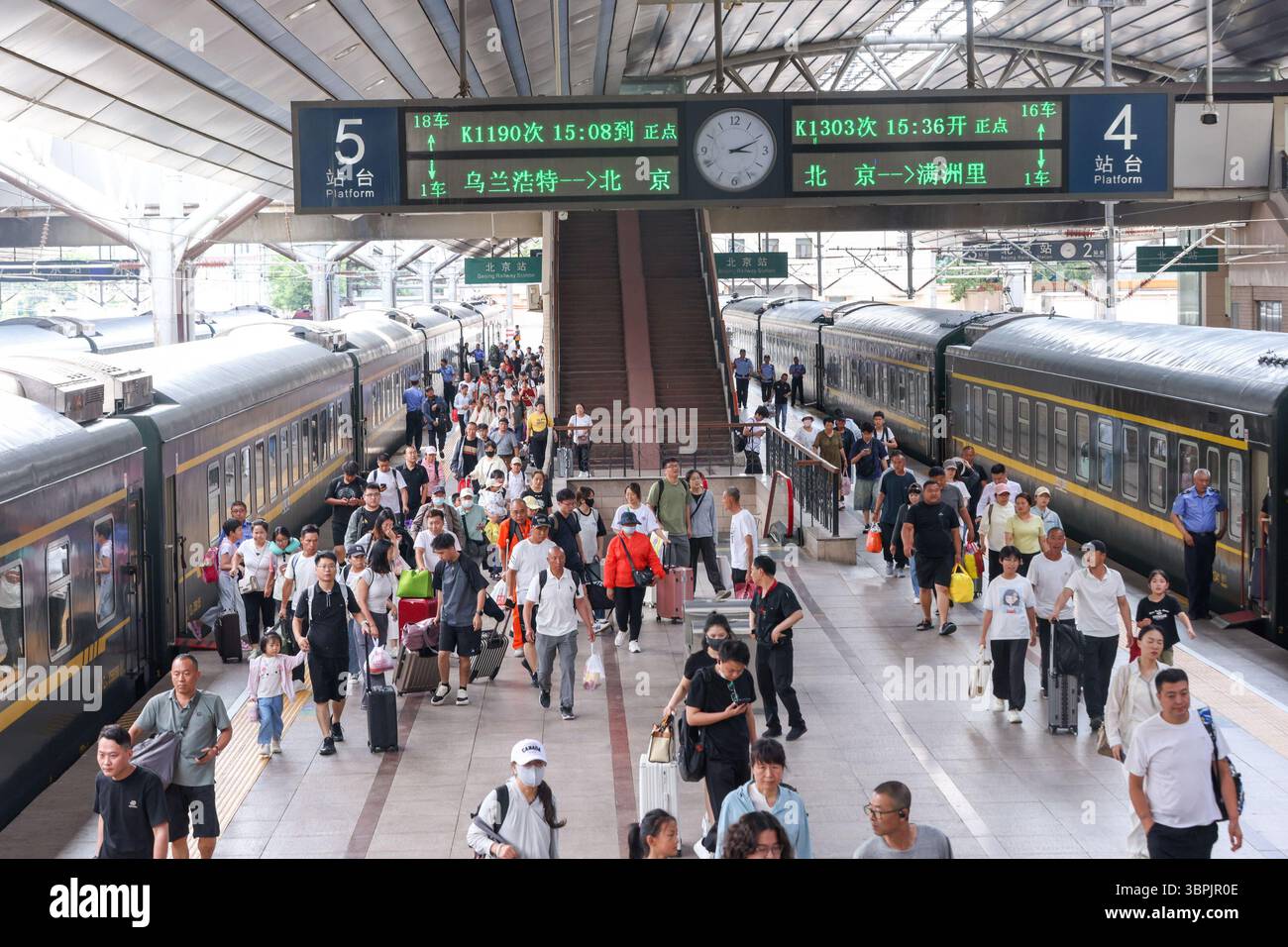 Beijing,China.7th July 2025. Passengers walk on the platform of Beijing ...