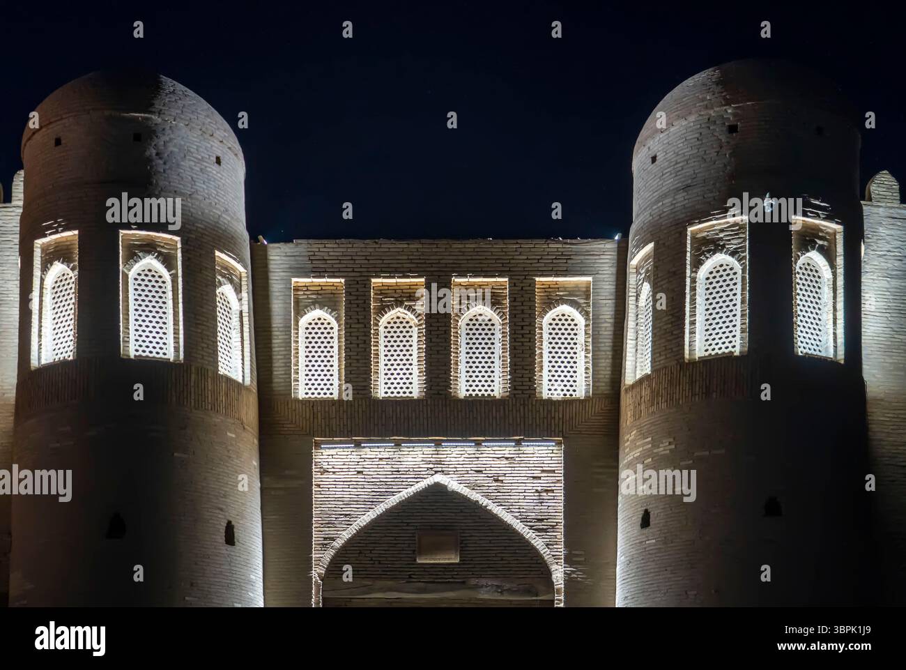 A beautifully illuminated historical fortress at night, showcasing its ...