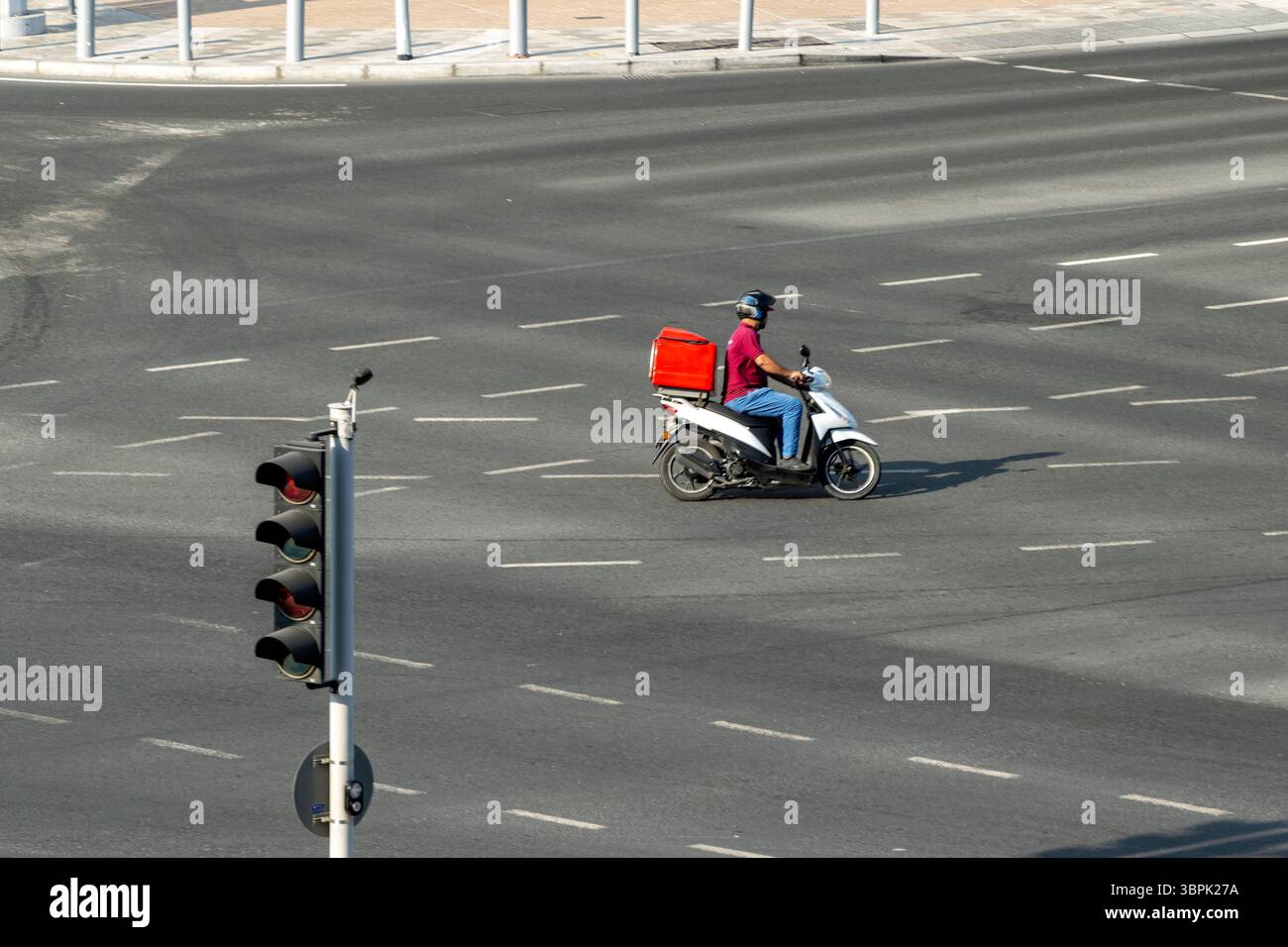 Delivery boy Talabat food Delivery rider on road. Online food ordering ...