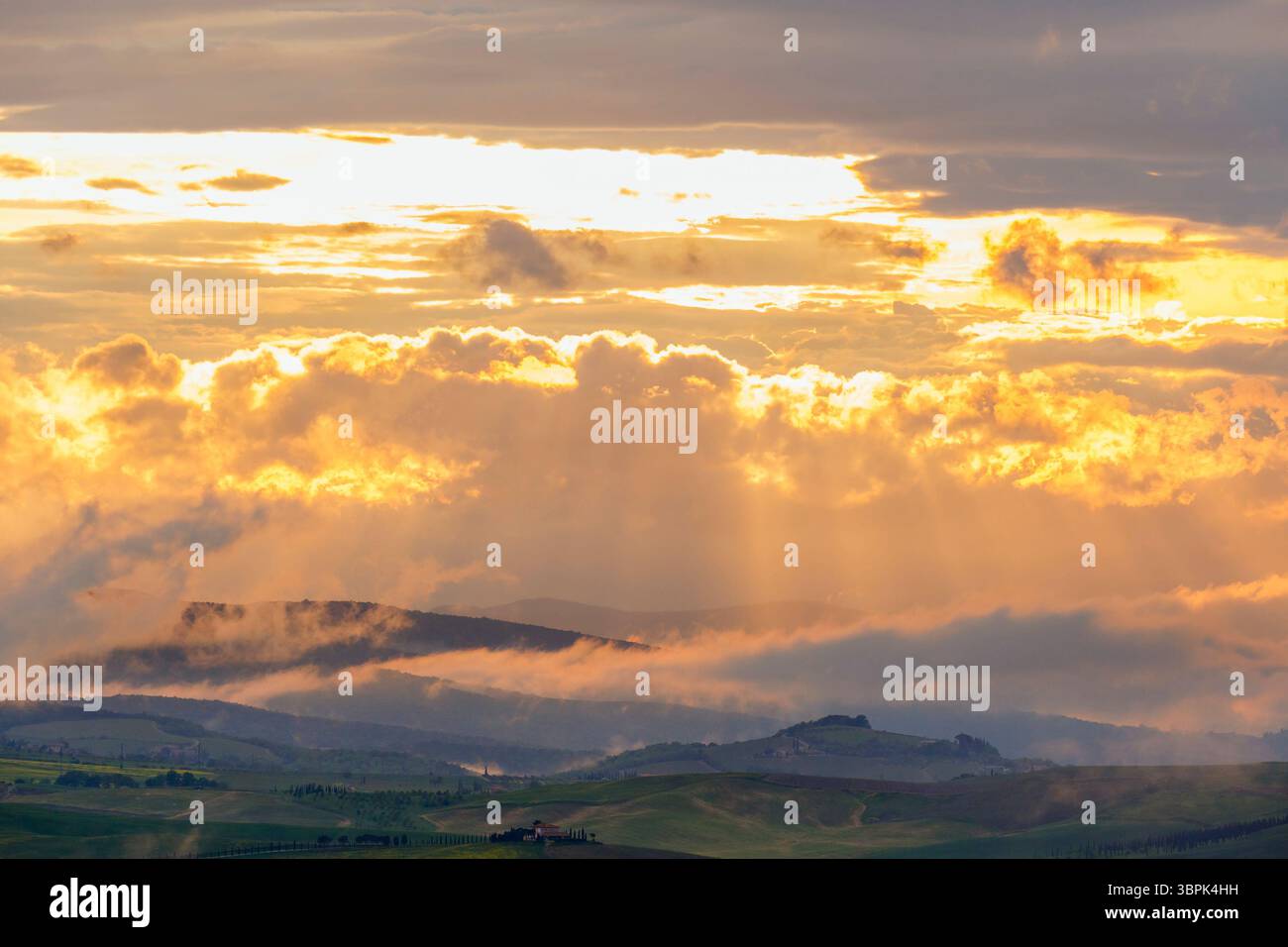Scenic rolling hilly landscape at sunset Stock Photo - Alamy