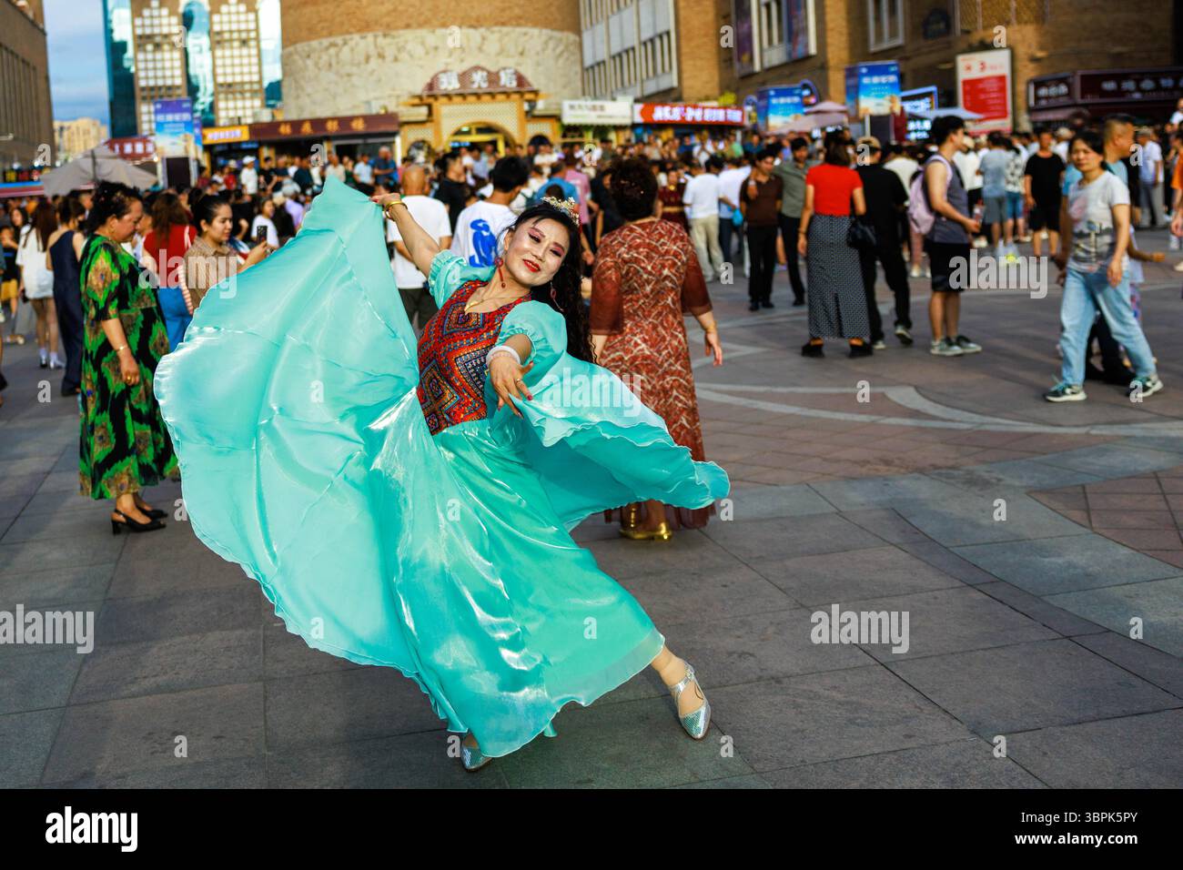 Tourists visit the Grand Bazaar in Urumqi City, northwest China's ...