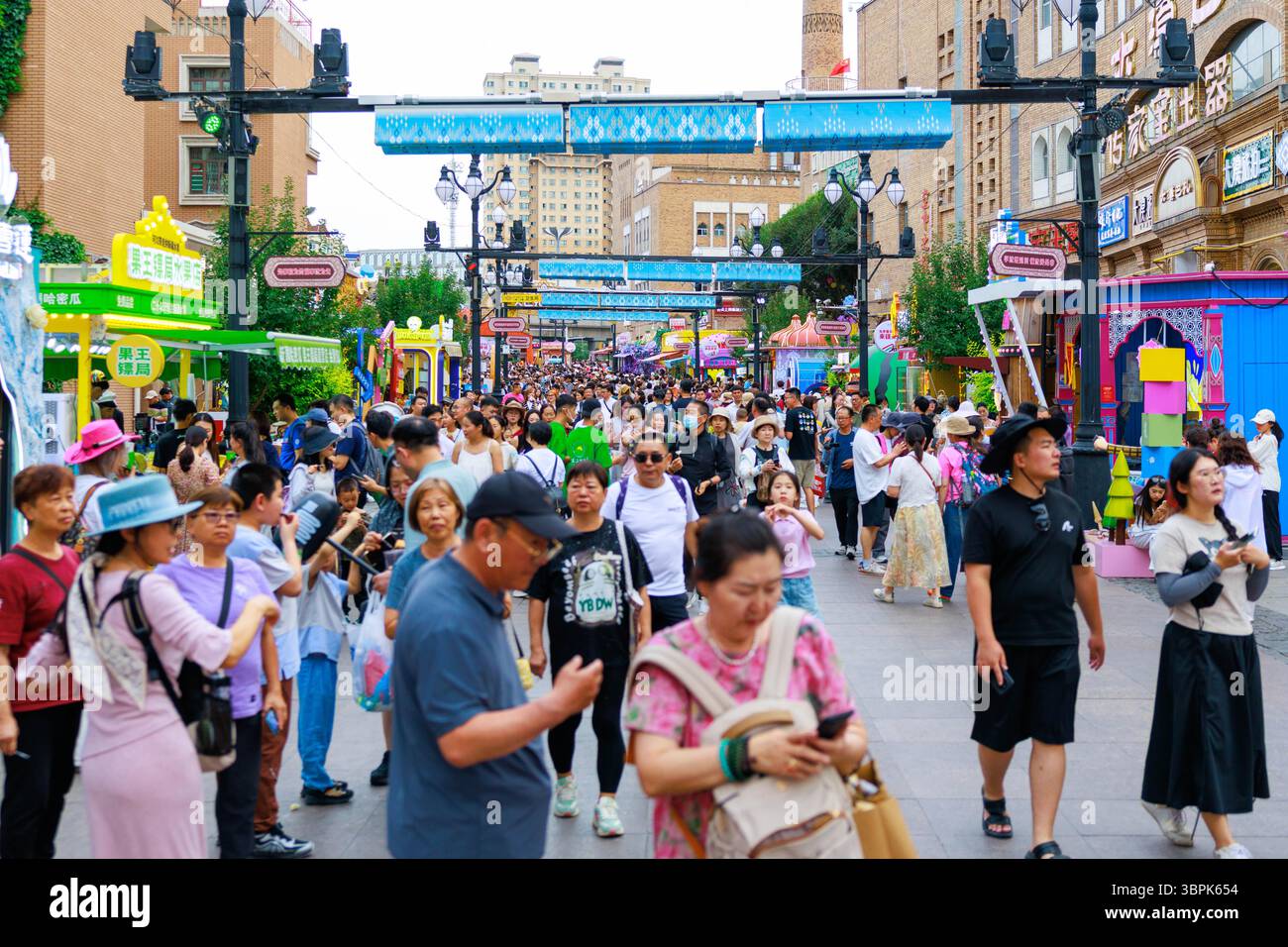 Tourists visit the Grand Bazaar in Urumqi City, northwest China's ...