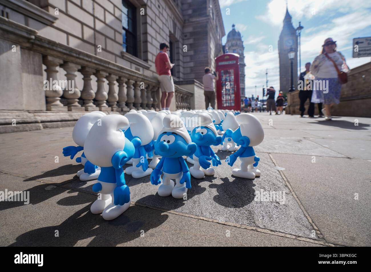London, UK 9 July 2025. A trail of Smurfs spill put from a red phone ...